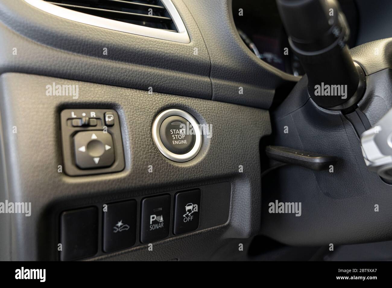start stop engine button in the car interior Stock Photo - Alamy