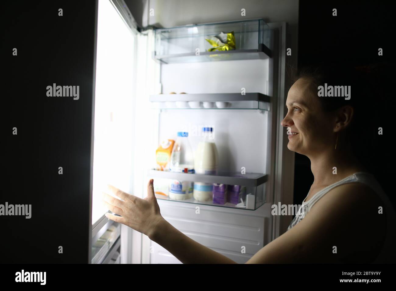 Full fridge woman hi-res stock photography and images - Alamy