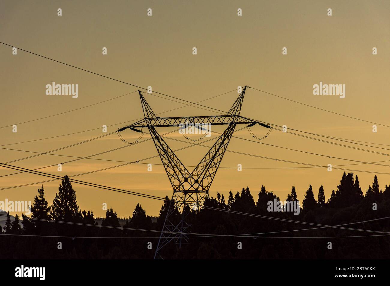 Scene view high voltage power lines silhouette at sunset Stock Photo ...