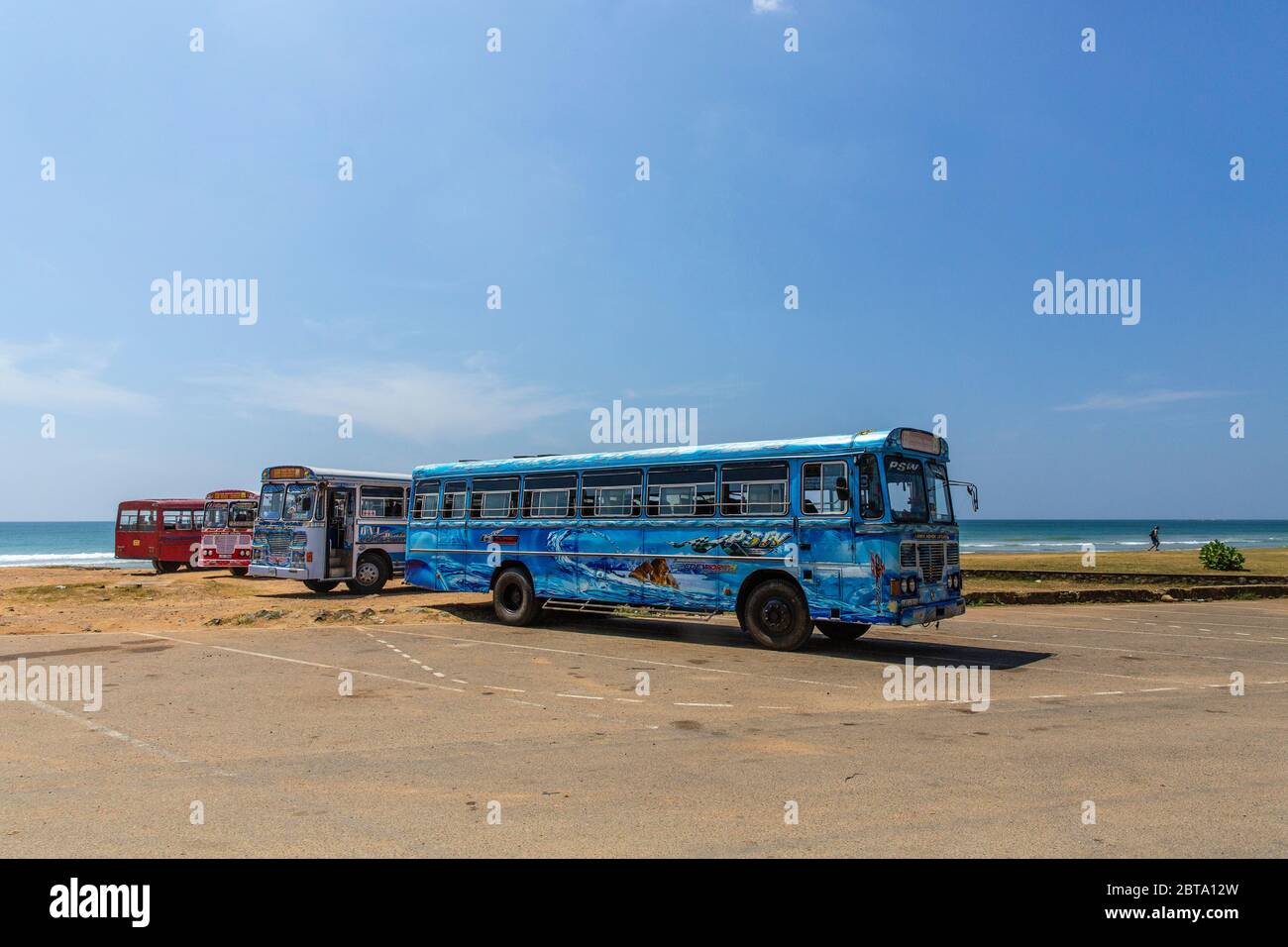 Buses parked by the sea Stock Photo - Alamy