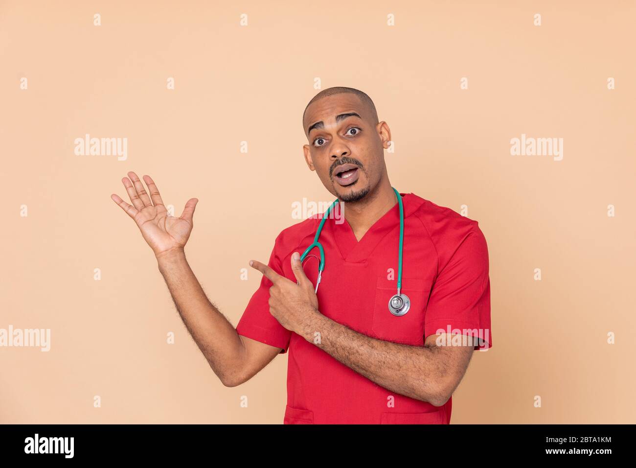 African doctor wearing red uniform on a orange background Stock Photo ...