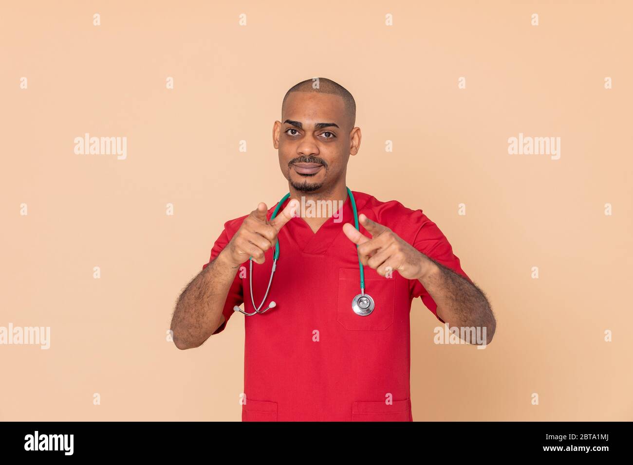African doctor wearing a red uniform isolated on a white background ...