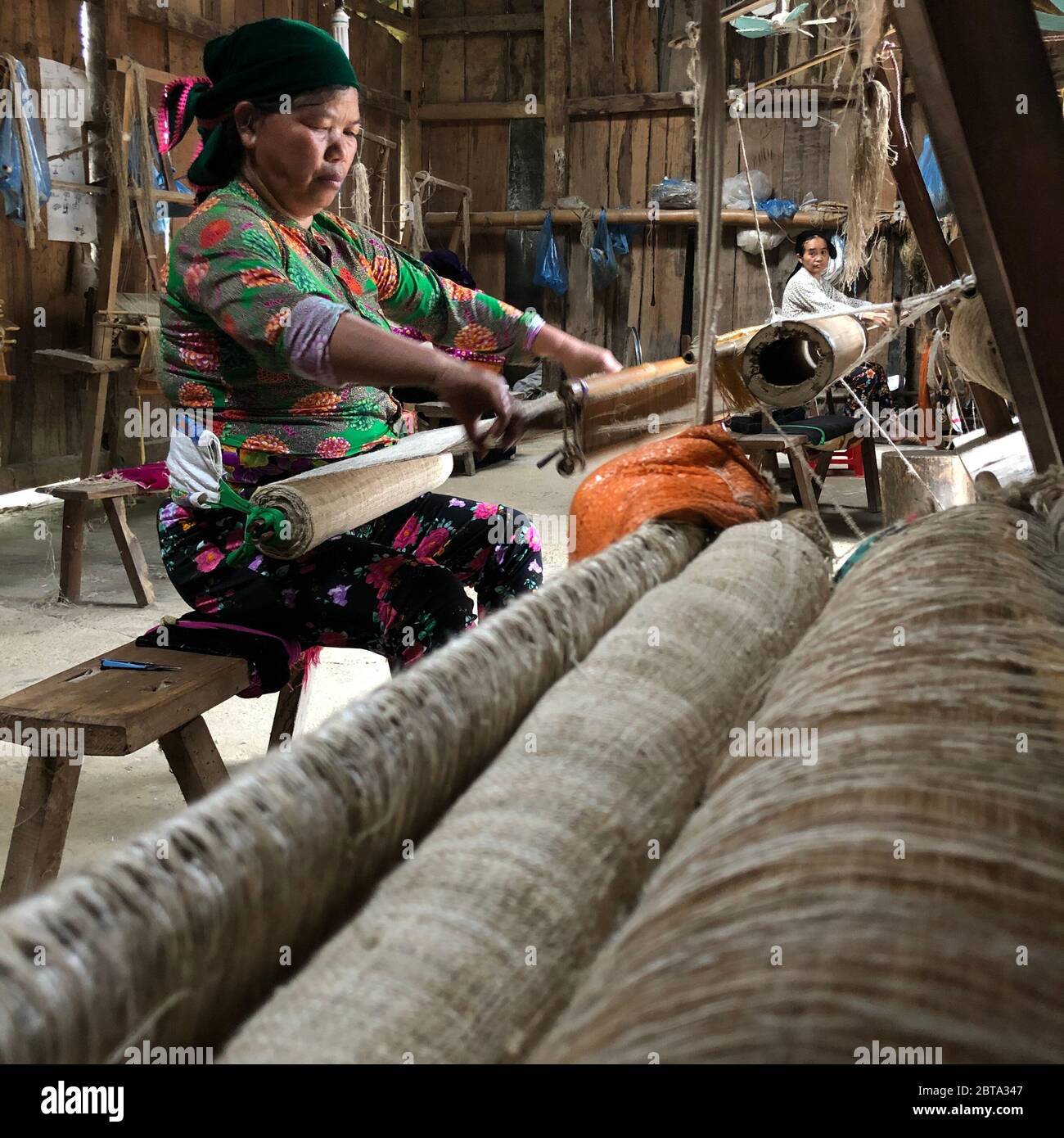 Lung Tam, Vietnam - January 9, 2020 - Woman weaving in a traditional ...