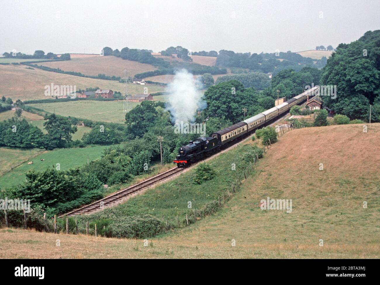Steam train leaving Stogumber station on the West Somerset Heritage ...