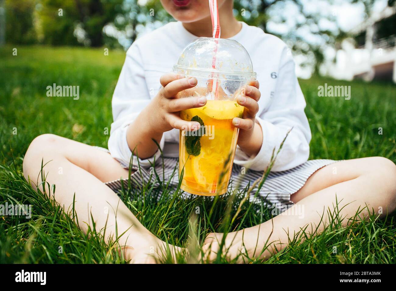 Child drinking through straw hi-res stock photography and images - Alamy