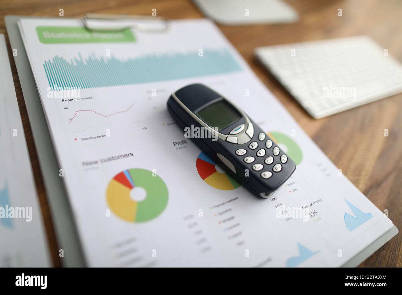 Phone is statistical report, profit from customers Stock Photo - Alamy