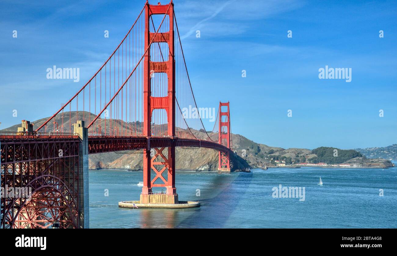 The red Golden Gate bridge spans San Francisco Bay Stock Photo - Alamy