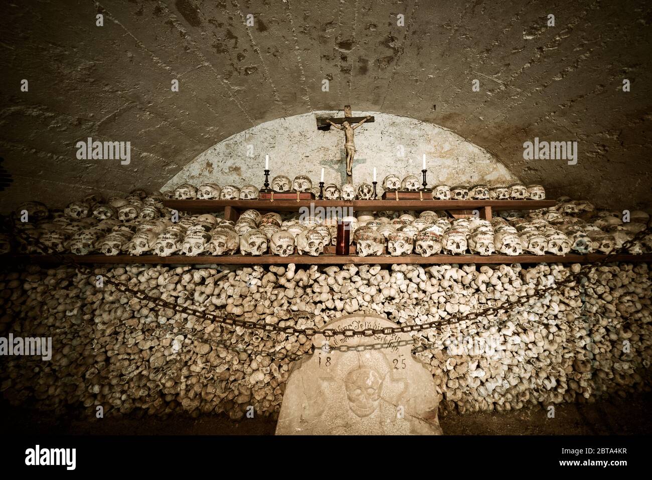View of hundreds of painted skulls and bones inside the famous charnel ...