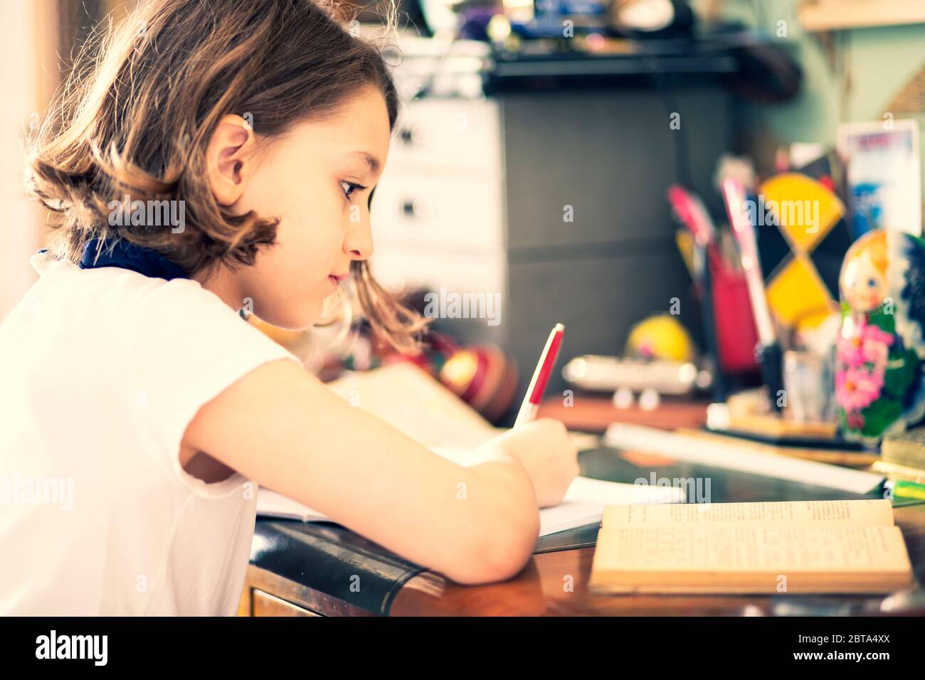 Girl studying home desk hi-res stock photography and images - Alamy