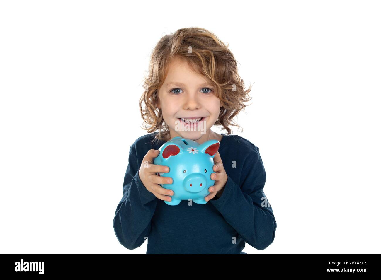 Cute little boy with a blue moneybox isolated on a white background ...