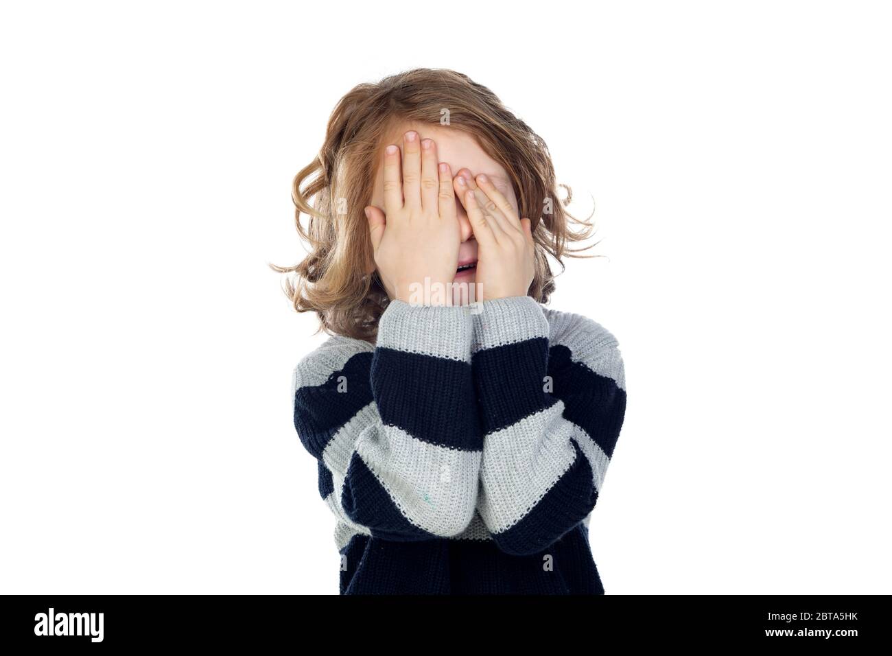 Scared cute boy covering his face isolated on a white background Stock ...