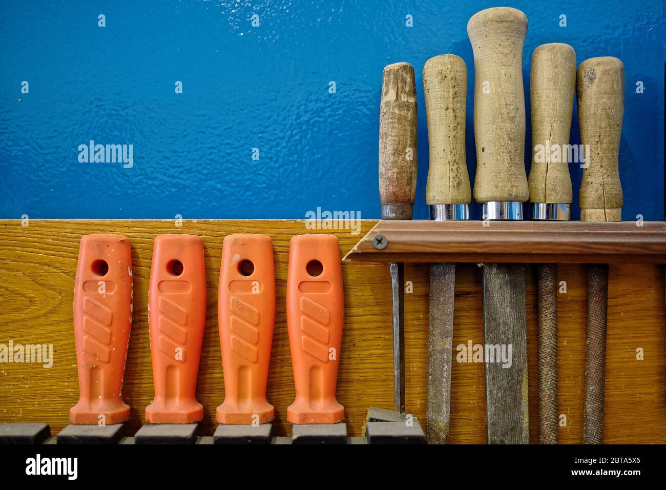 The carpenter's tools hang neatly on the wall. Workplace order. Rashpil ...