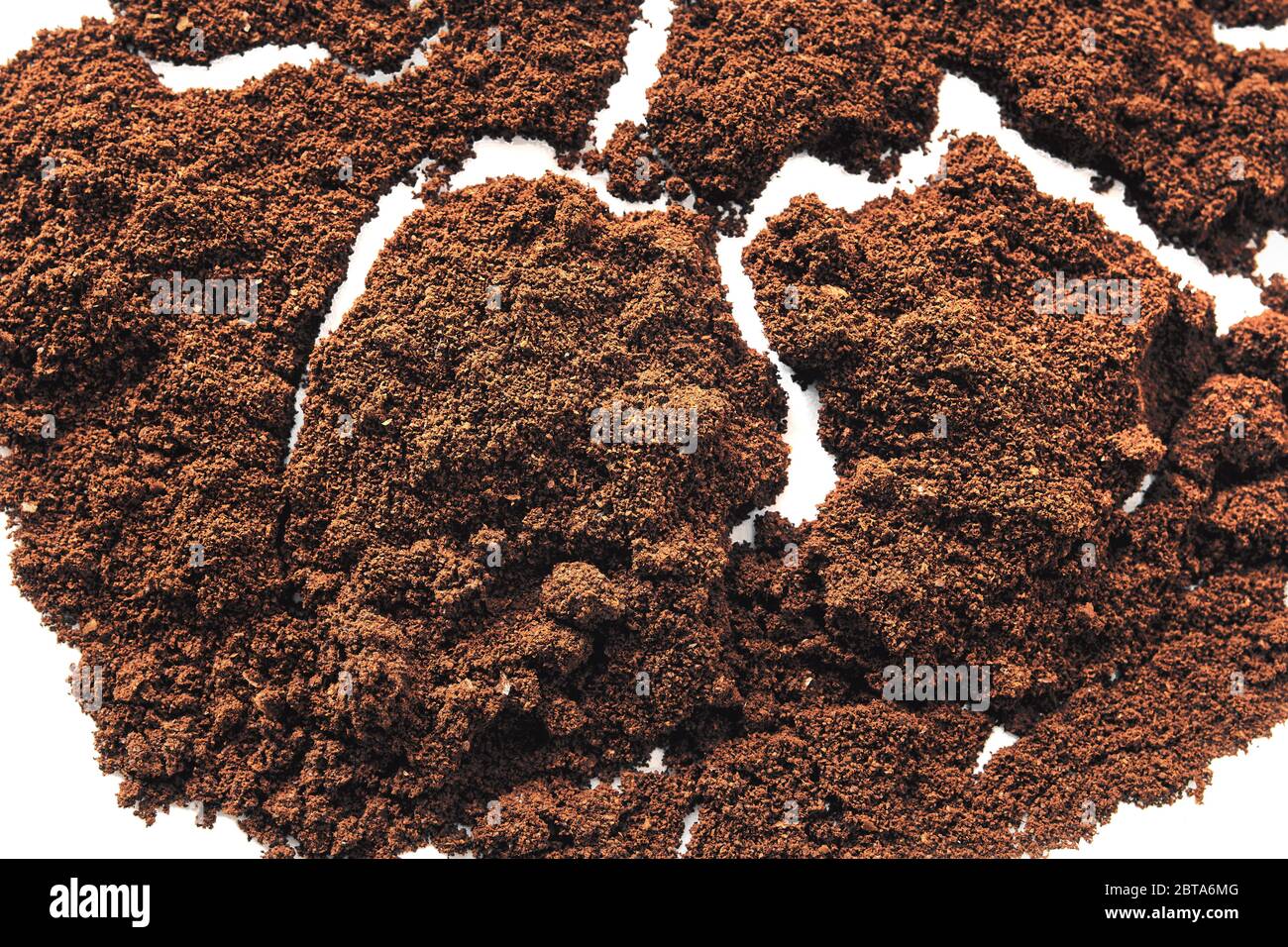 Dark ground coffee bean crushed craked broken isolated on white ...
