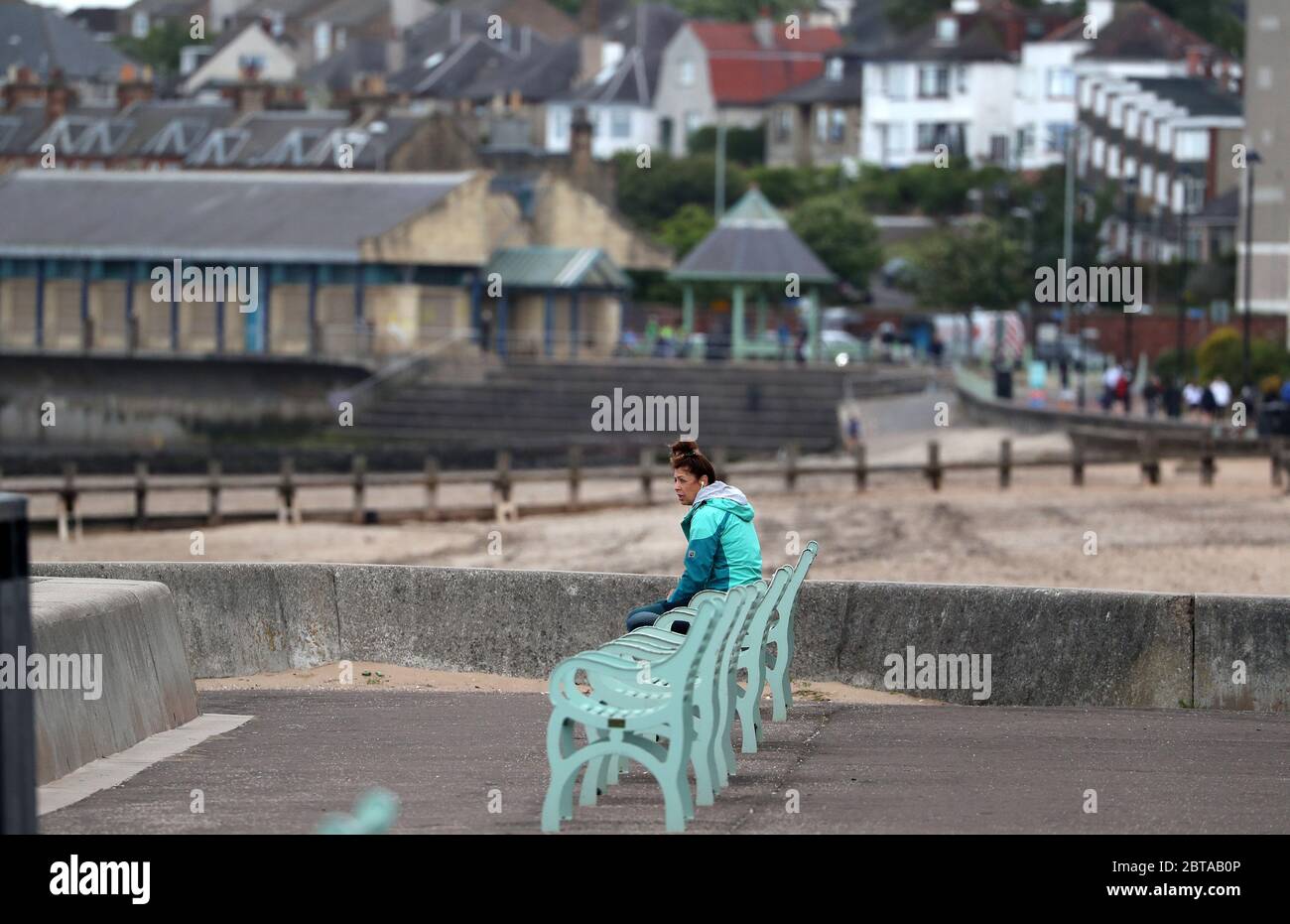 Sits on bench at portobello beach near edinburgh hi-res stock ...