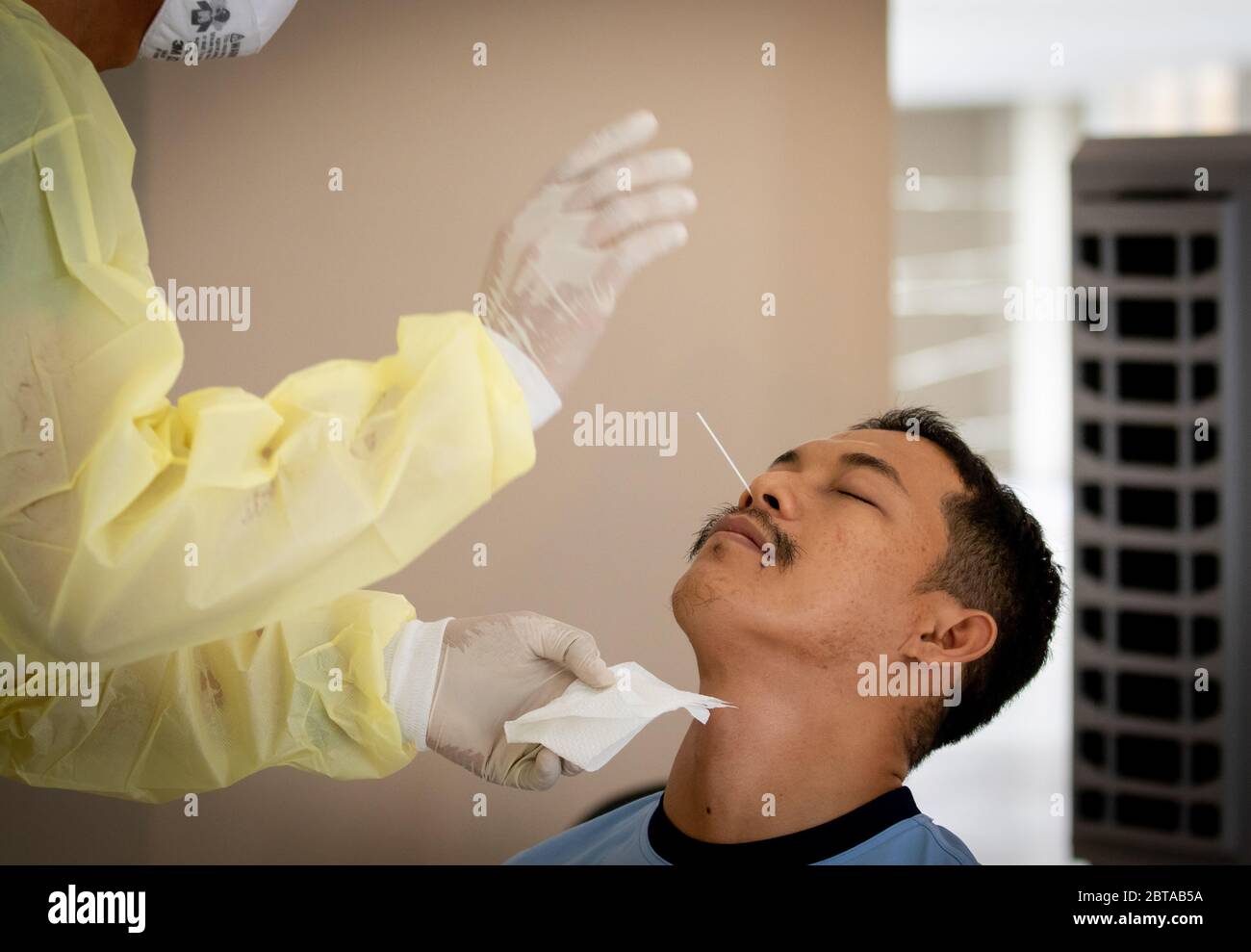 Participant on swab testing training during a demonstration conducted ...