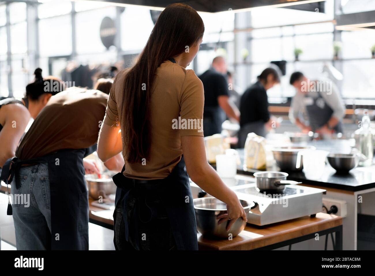 Culinary class. Back view of the process of cooking. Different ...