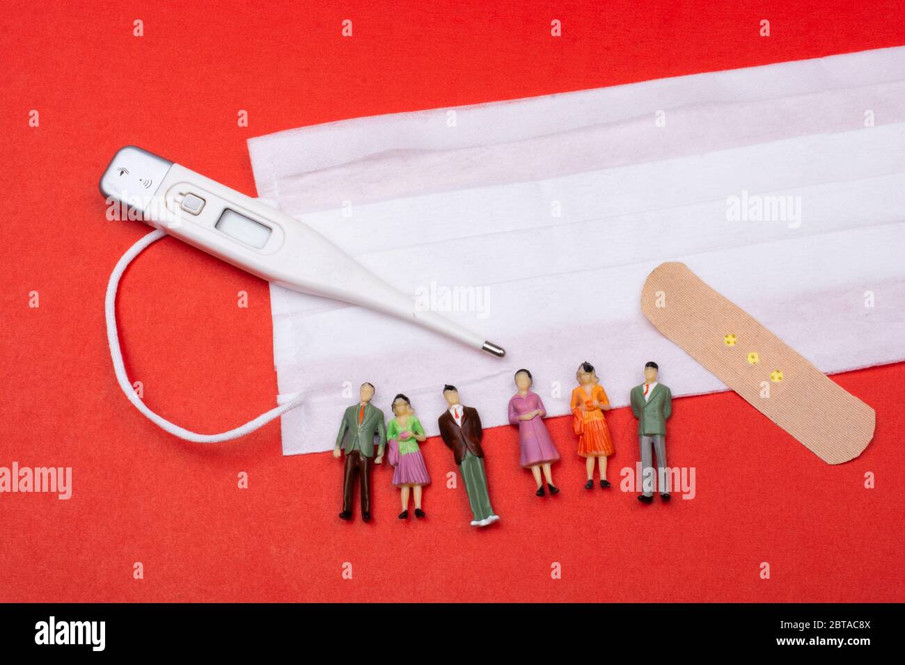 White color medical mask on red color Stock Photo - Alamy