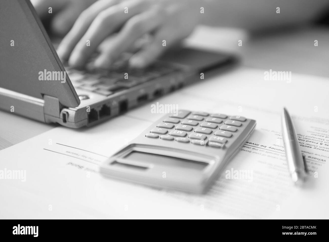 Black and white photo of man doing taxes and working from home Stock ...