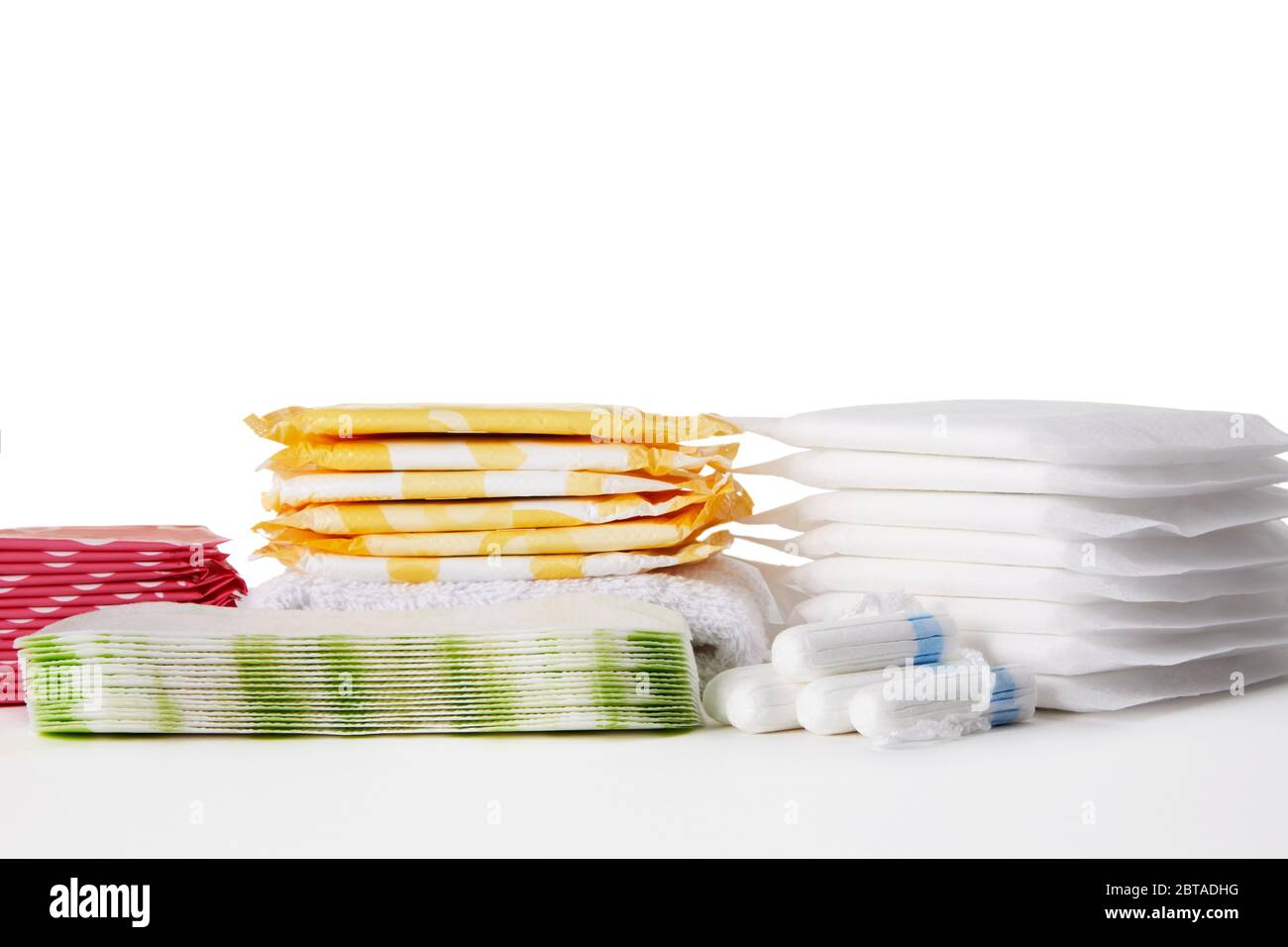 different menstrual sanitary cotton pads and tampons on white ...