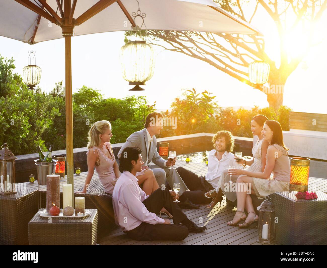 Friends Drinking together in balcony bar Stock Photo - Alamy