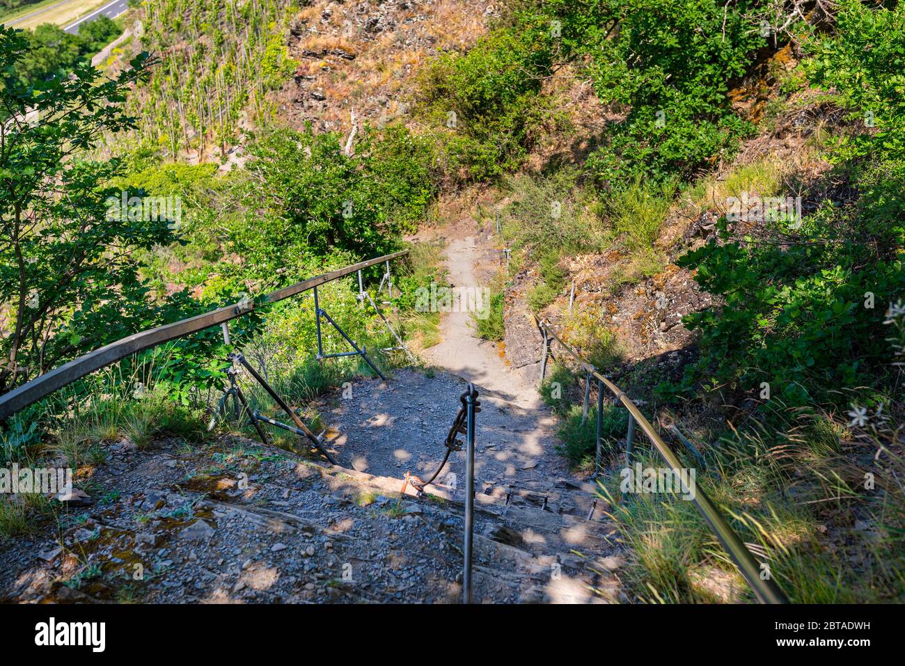Metal handrail and rail on the trail in wineries on a steep slate trail ...