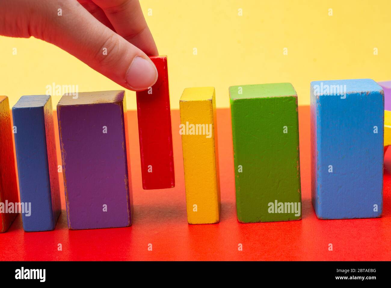 Different color and shape wooden toy building blocks Stock Photo - Alamy