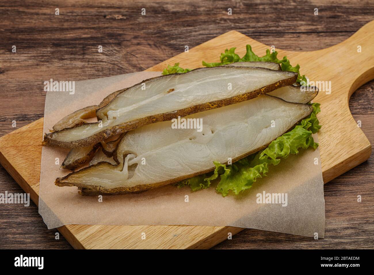 Delicous smoked halibut fish slices snack Stock Photo - Alamy