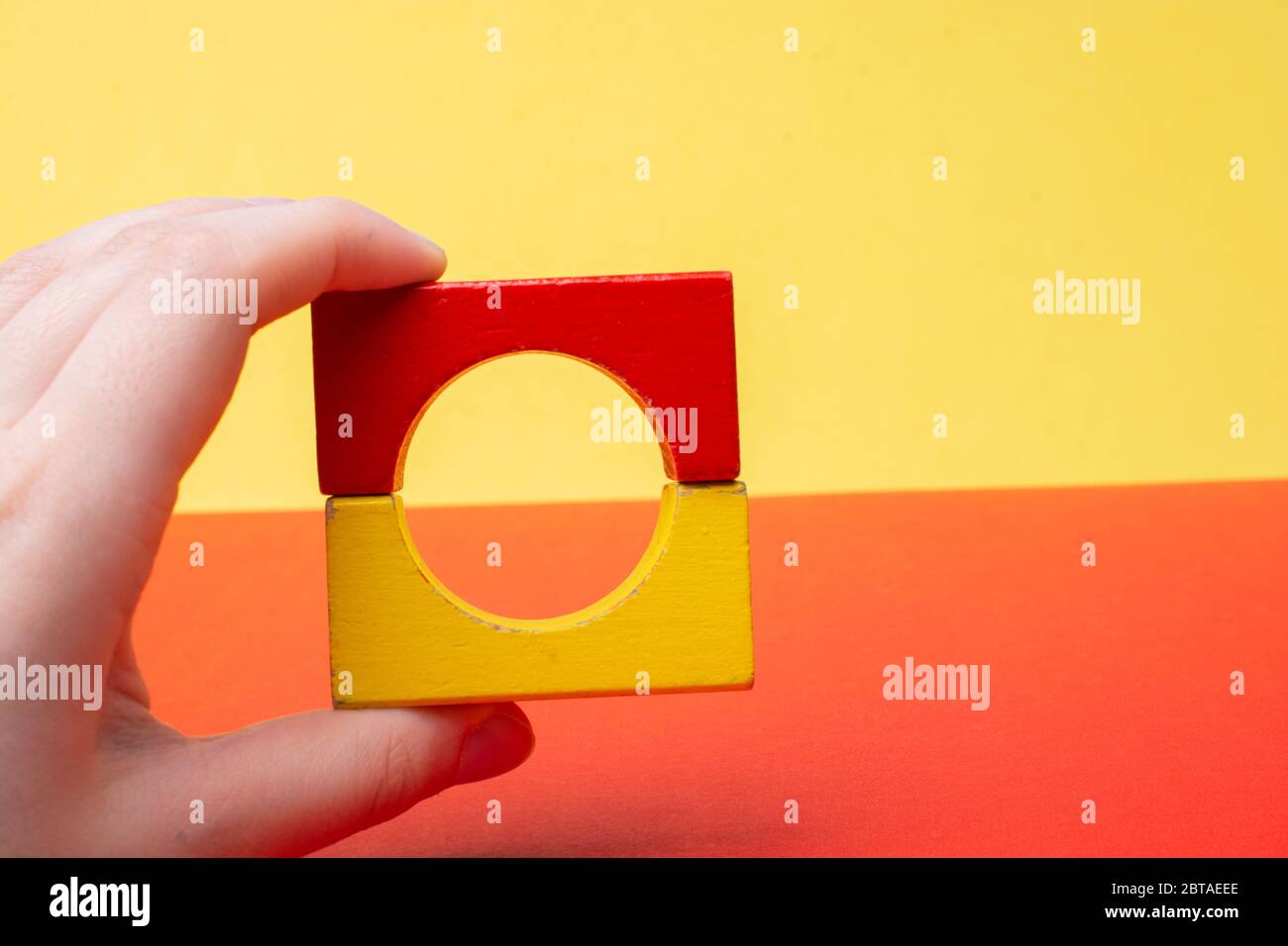 hand building tower with colorful building blocks Stock Photo - Alamy