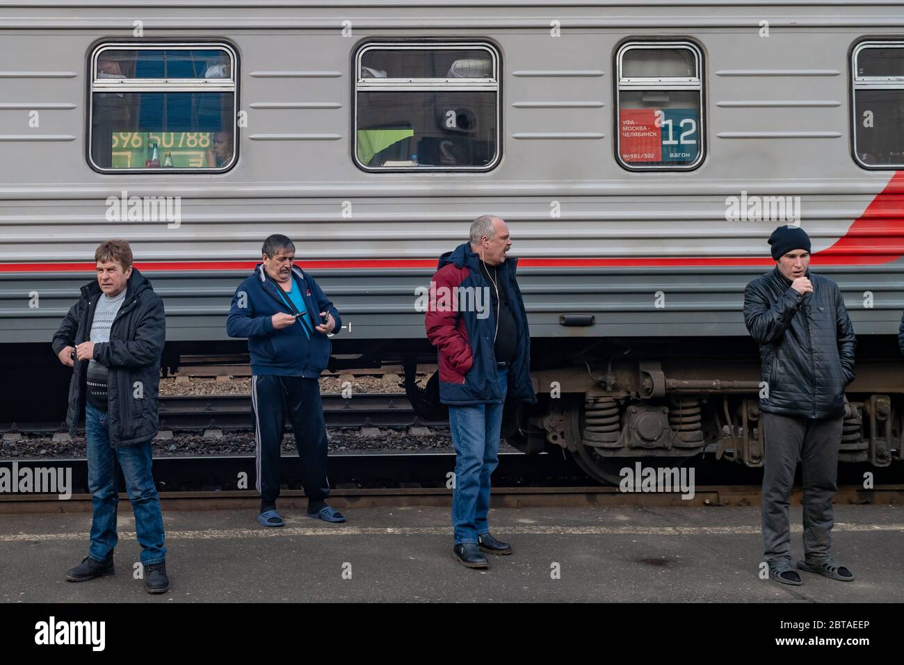 Men are waiting passenger train starts on Ryazan railway station ...