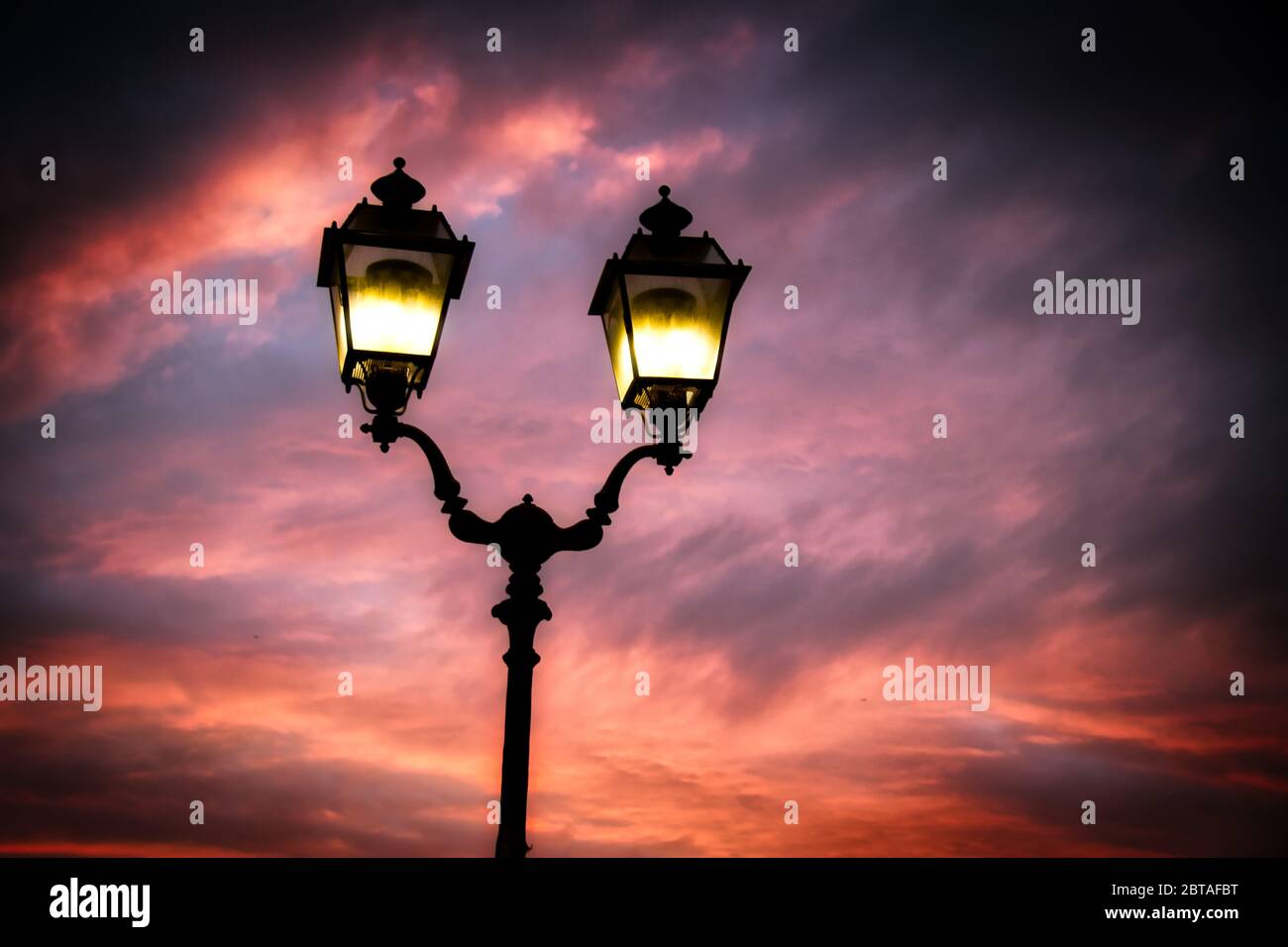 Antique electric street light and sky Stock Photo - Alamy