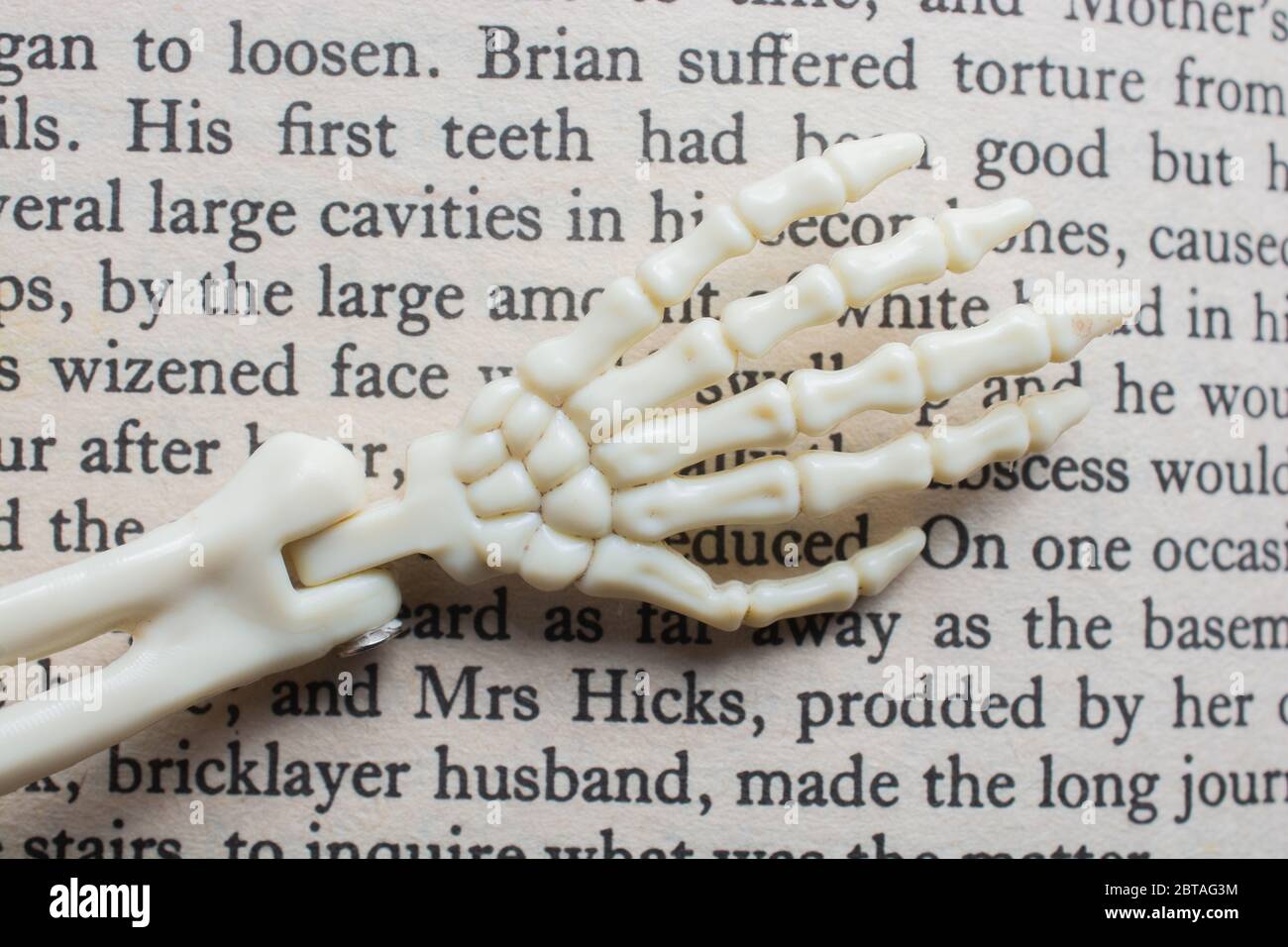 Skeletal hands book text. death, halloween and mistery concept Stock ...