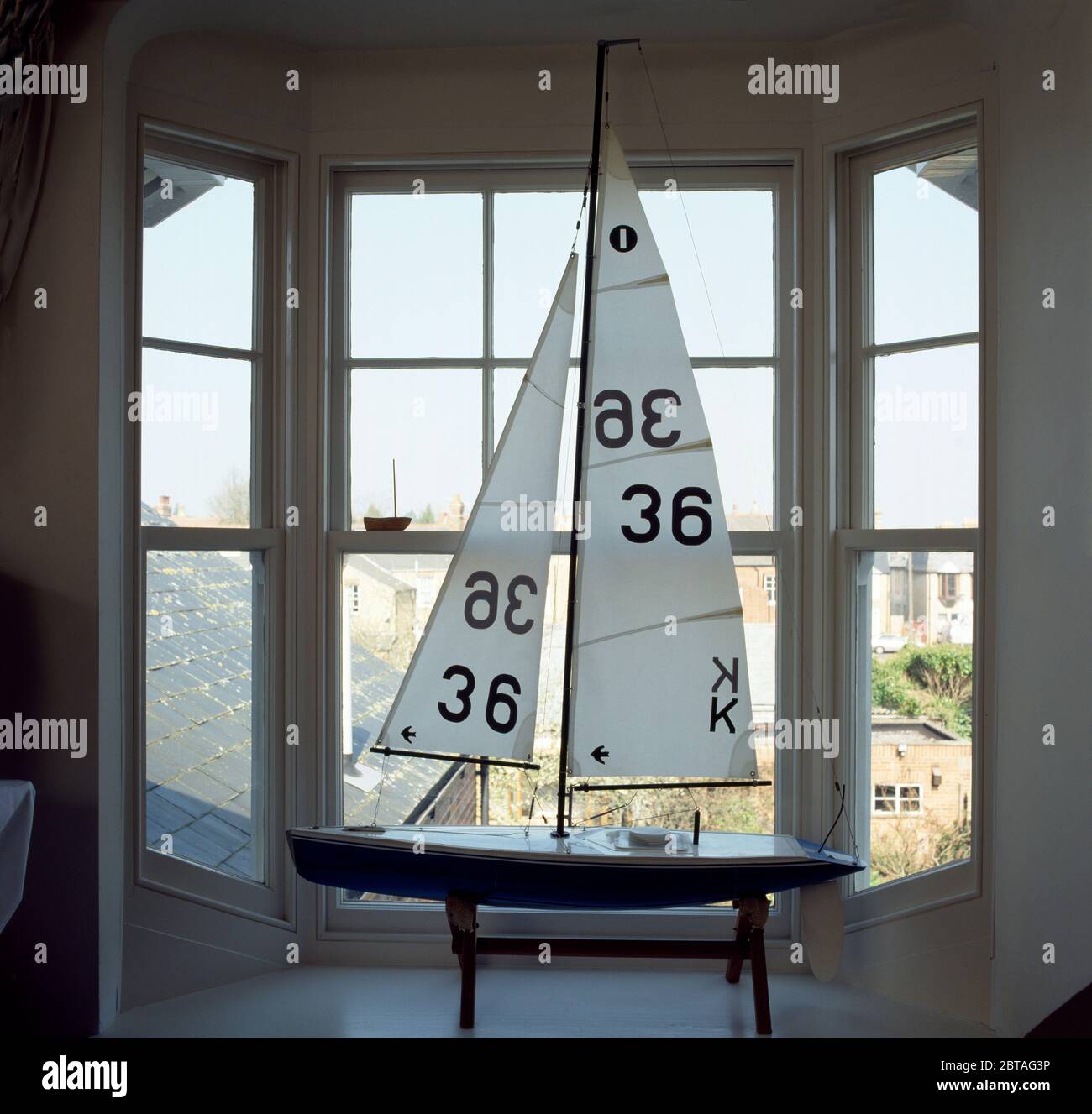 Large model yacht in bay window Stock Photo - Alamy