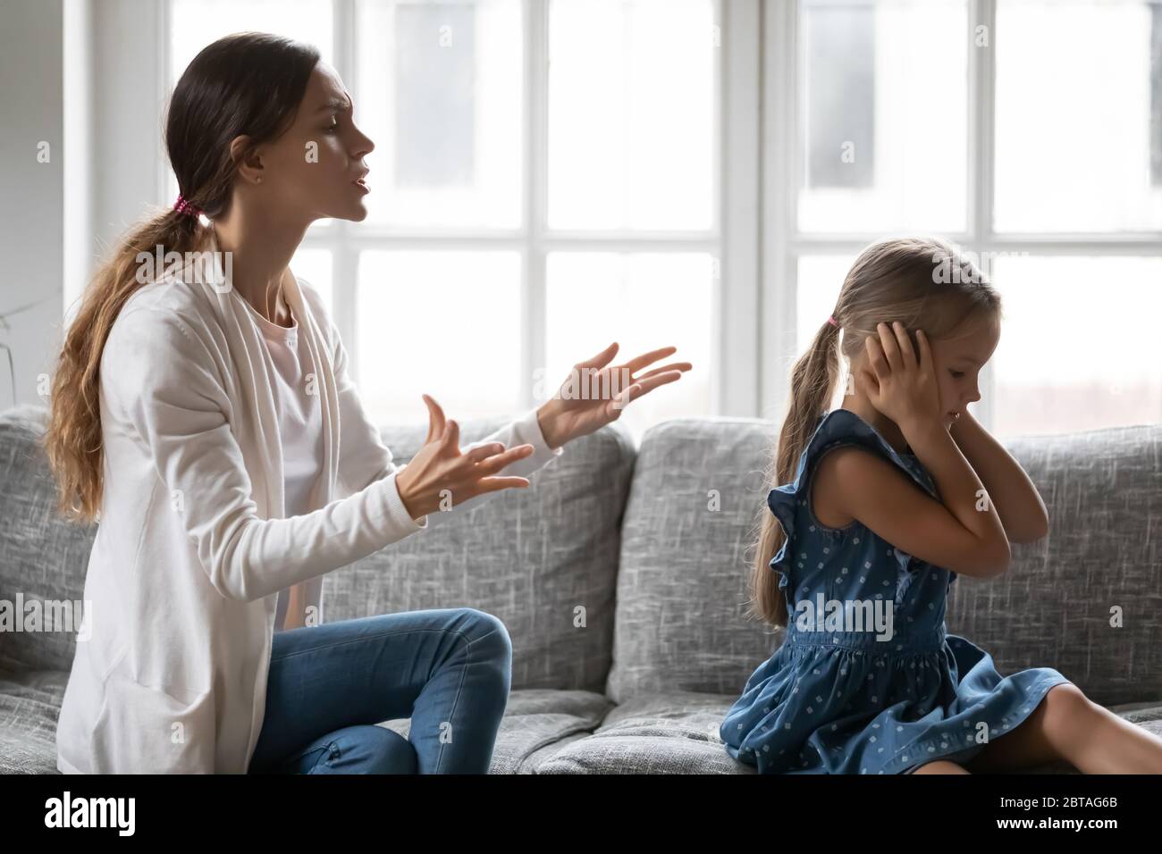 Little girl ignore young mom scolding and lecturing Stock Photo - Alamy