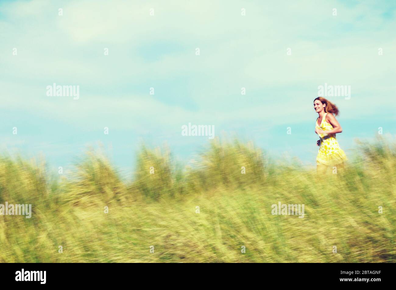 Woman Running Through Flowers High Resolution Stock Photography and ...