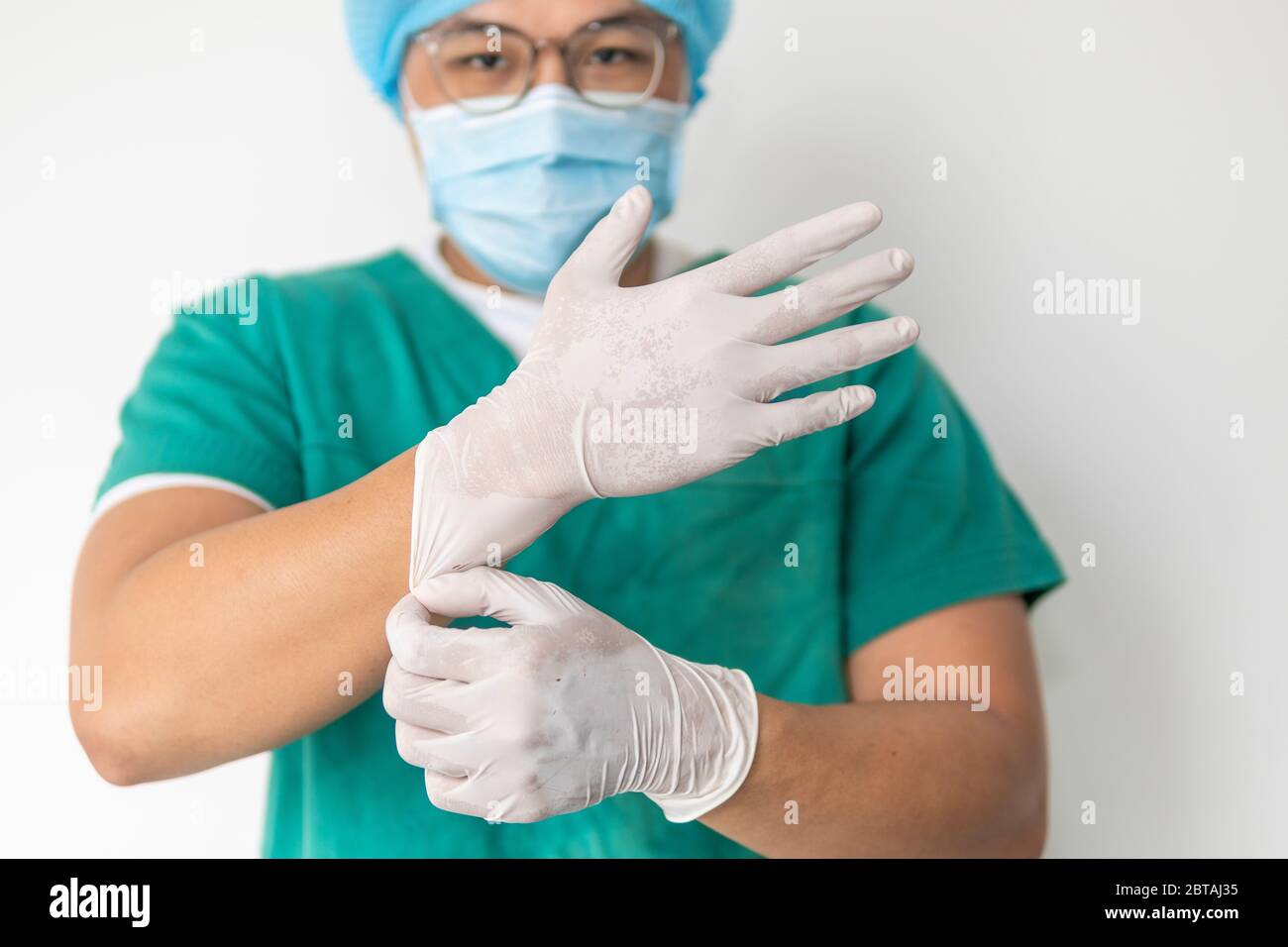 Doctor Puts on Gloves and Wearing Medical Mask. Medical, covid-19 ...
