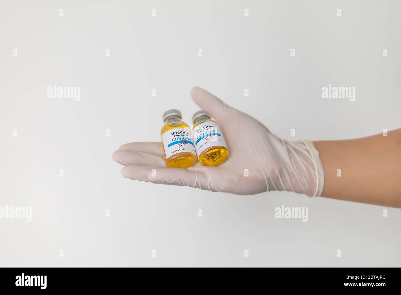 Doctor hand holding vial with medication, closeup. Vaccination and ...