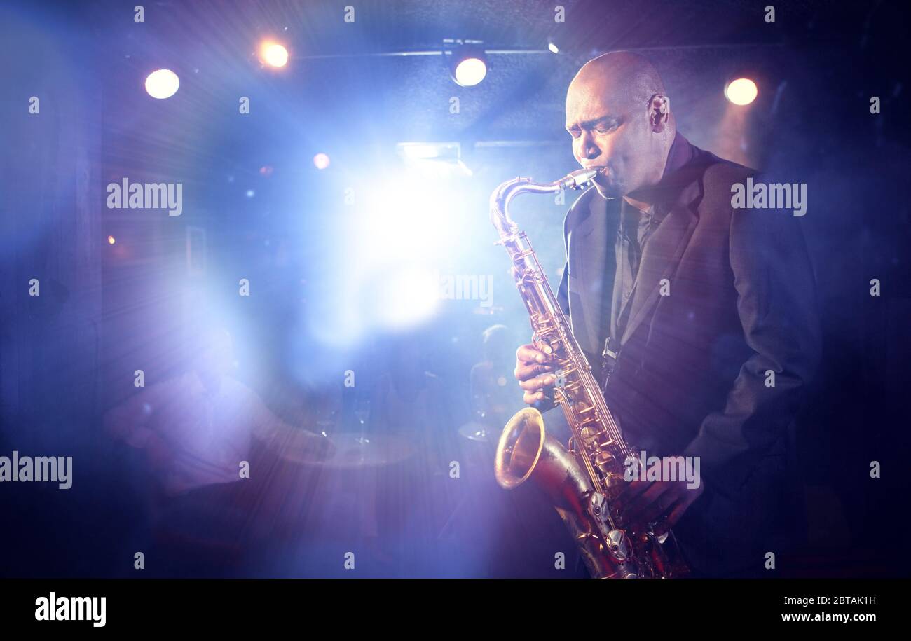 Black man playing sax in hi-res stock photography and images - Alamy