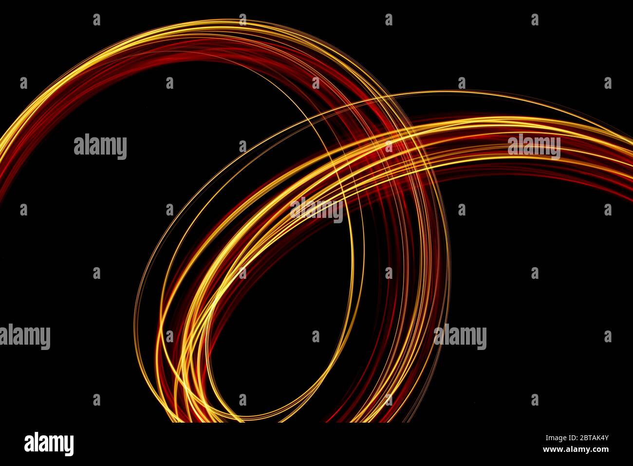 Long exposure photograph of neon colour in an abstract swirl, parallel ...