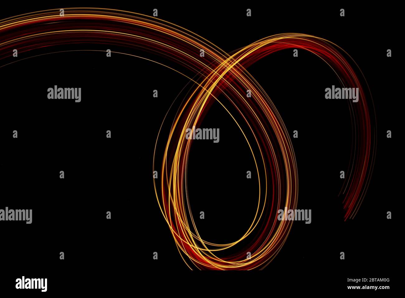 Long exposure photograph of neon colour in an abstract swirl, parallel ...