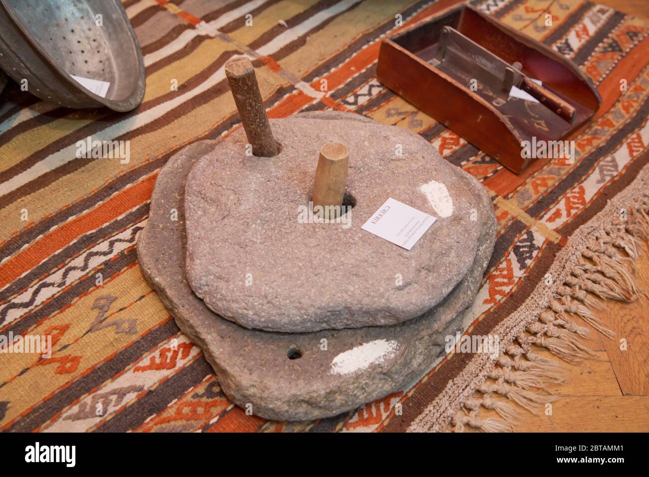Rotary discoid mill stone for hand-grinding a grain into flour ...