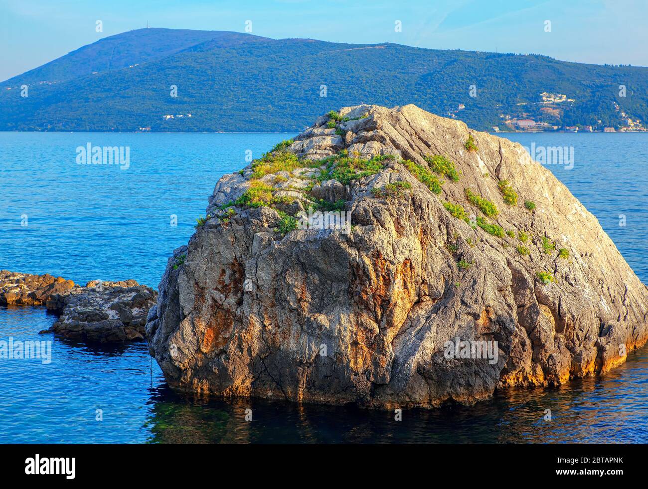 Sea scenery with rock foundation in the water Stock Photo - Alamy