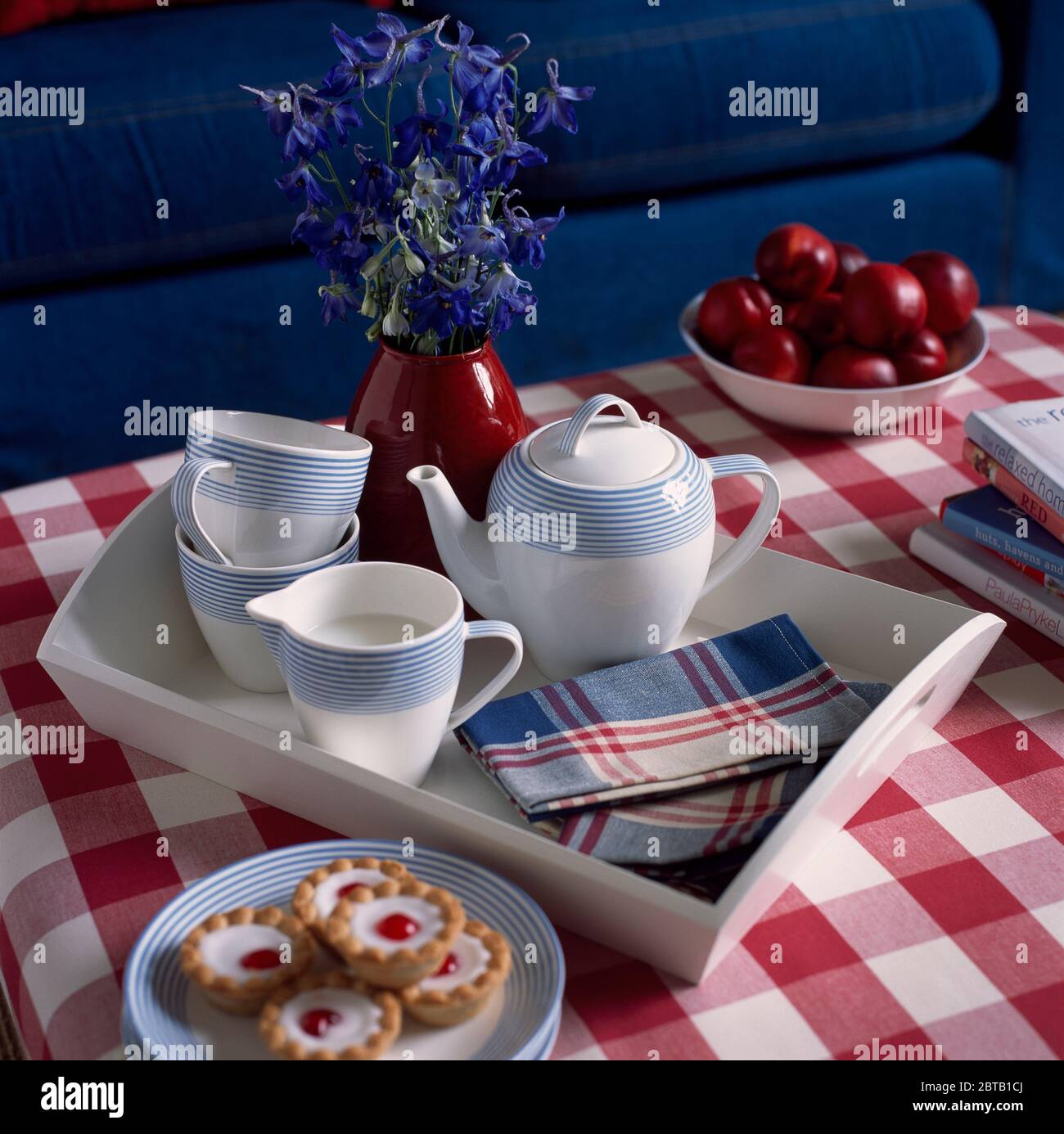 Striped tea set on white painted tray Stock Photo - Alamy
