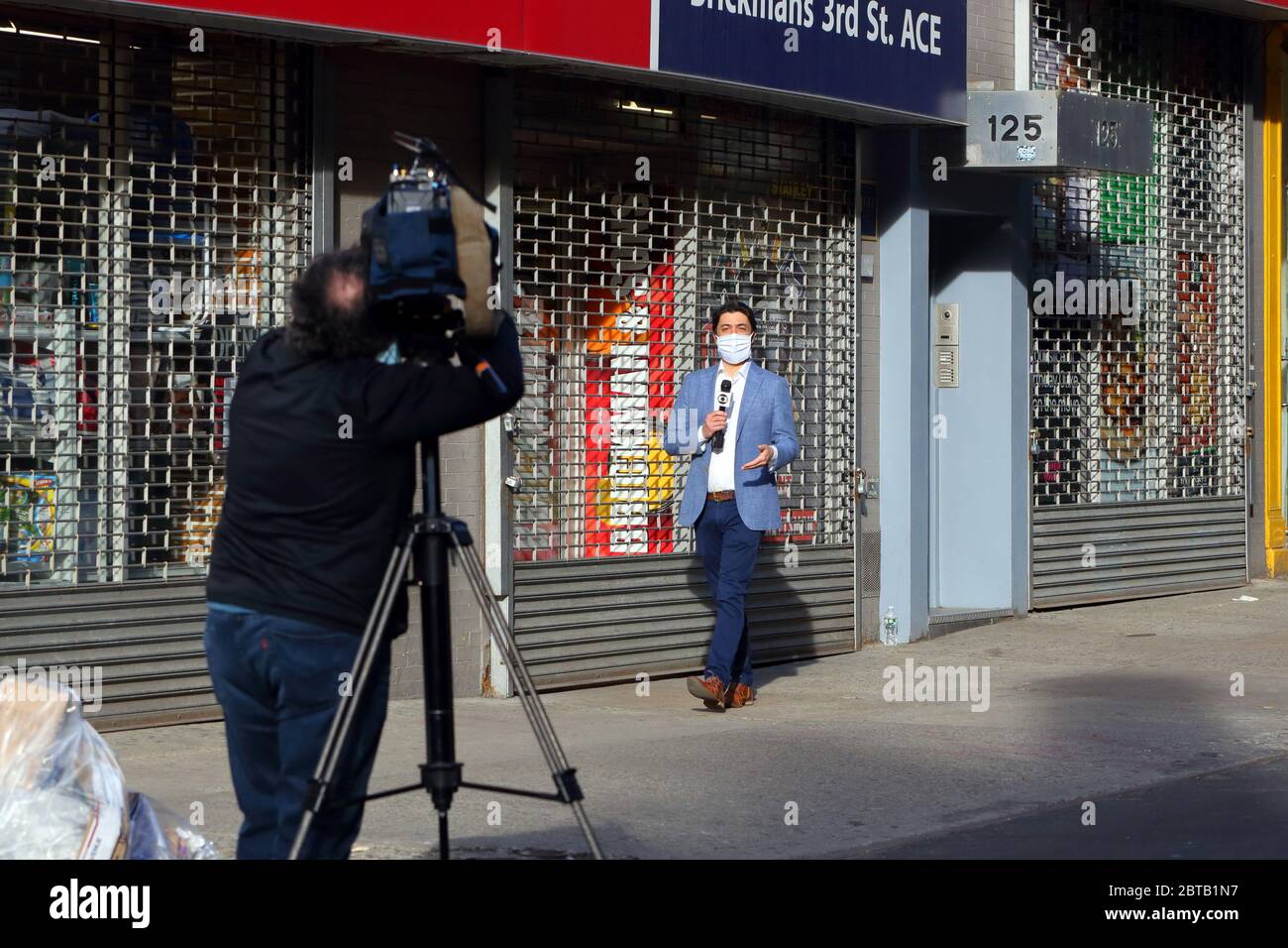 A mask wearing Brazilian TV Globo news reporter Tiago Eltz about to ...