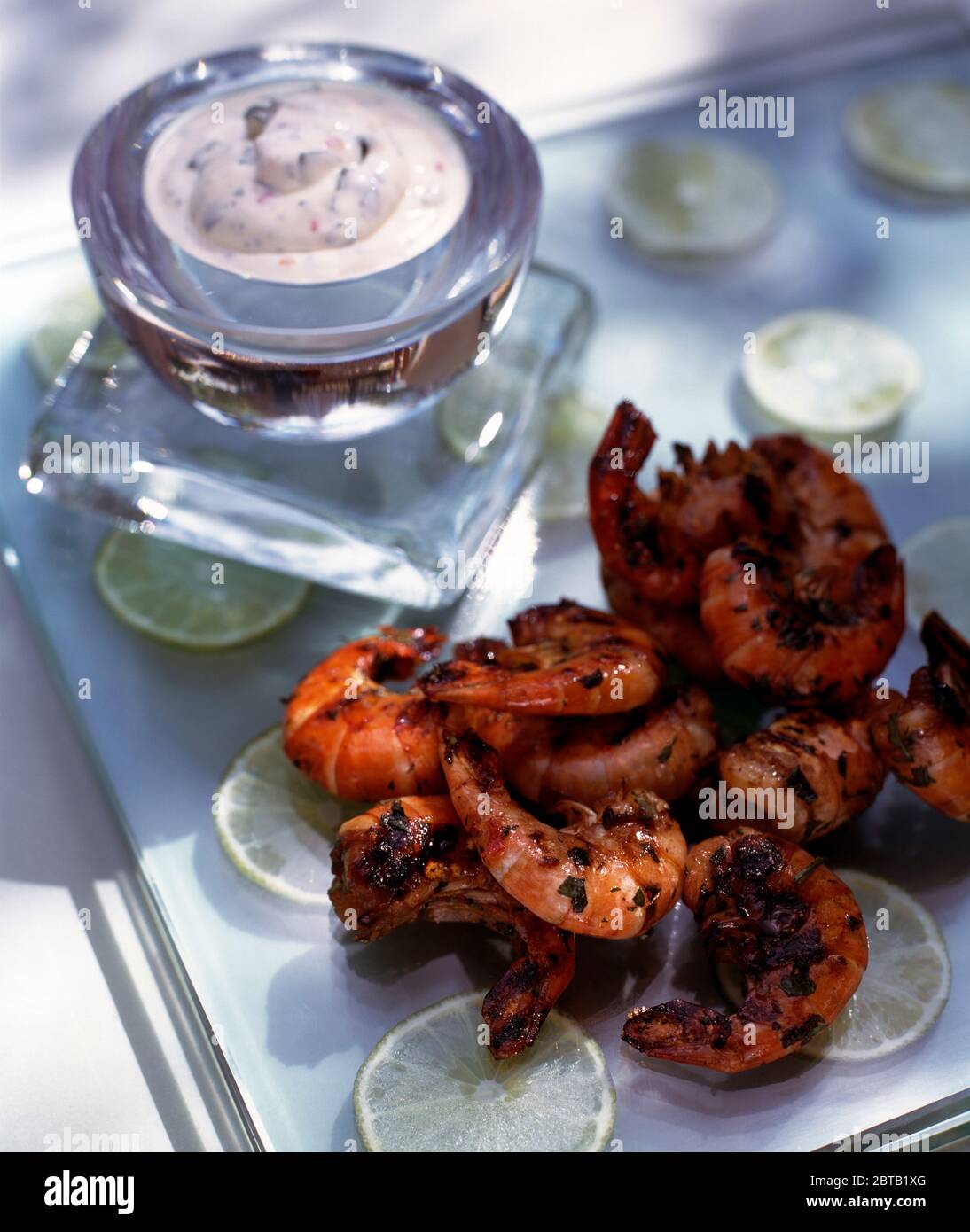 Plate of large barbequed prawns with fish mousse Stock Photo - Alamy