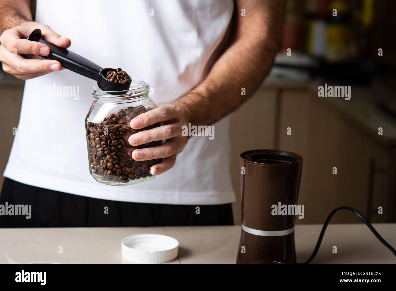 Man grounding coffee beans hi-res stock photography and images - Alamy