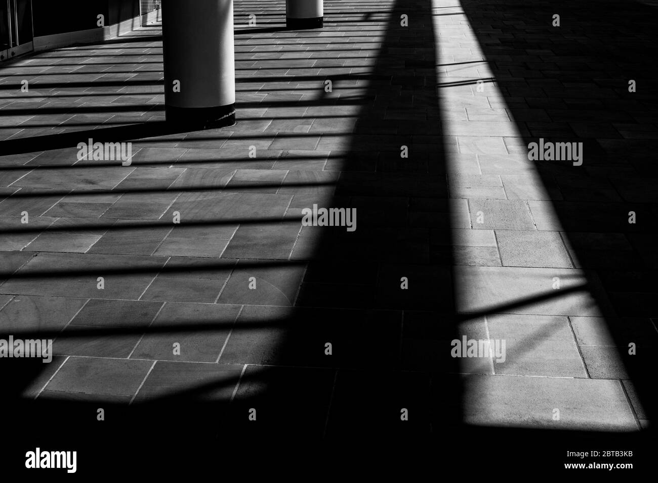 Black and white image of shadows falling on a pedestrian area Stock ...