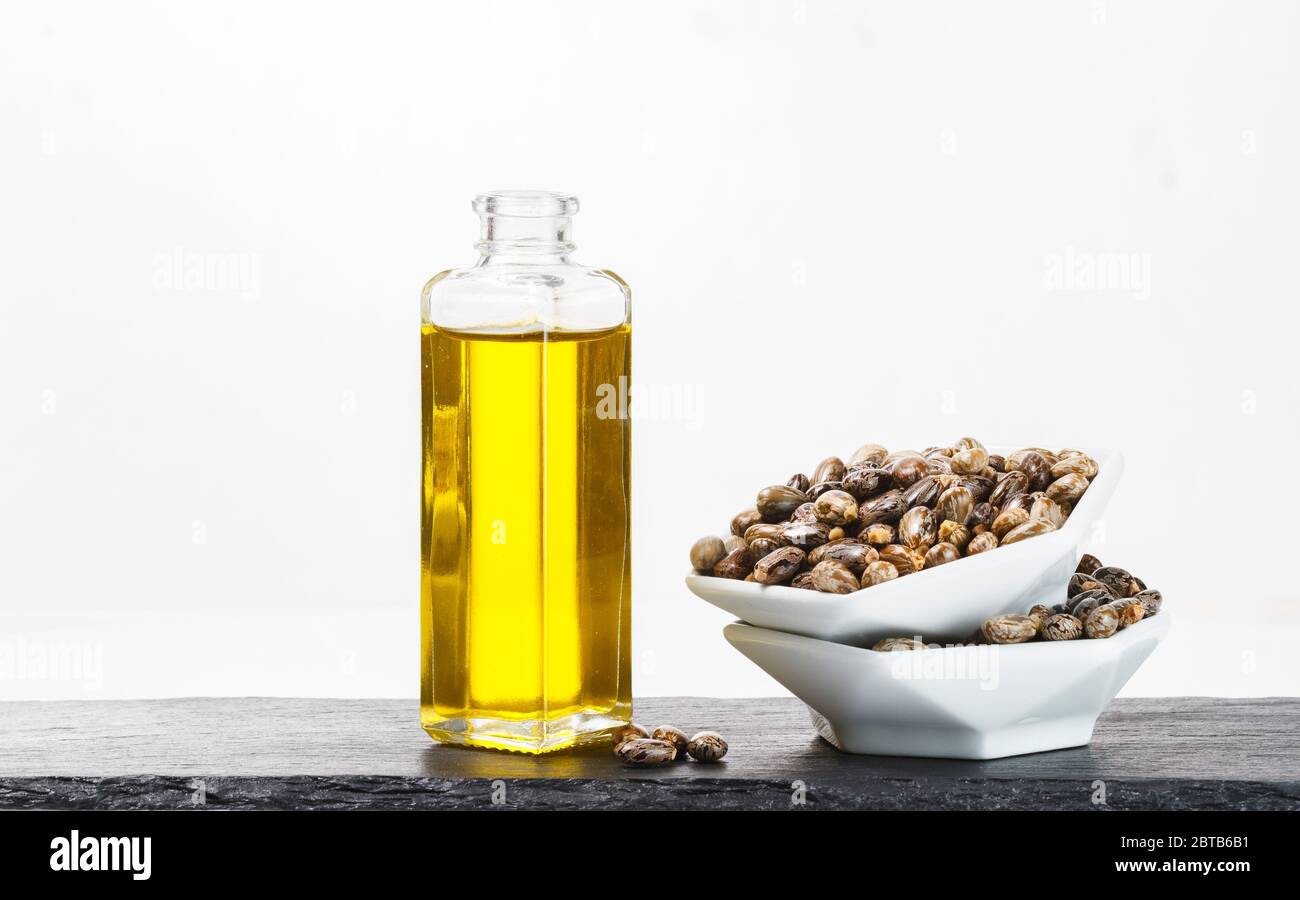 castor oil and seeds isolated on white background, close-up image Stock ...