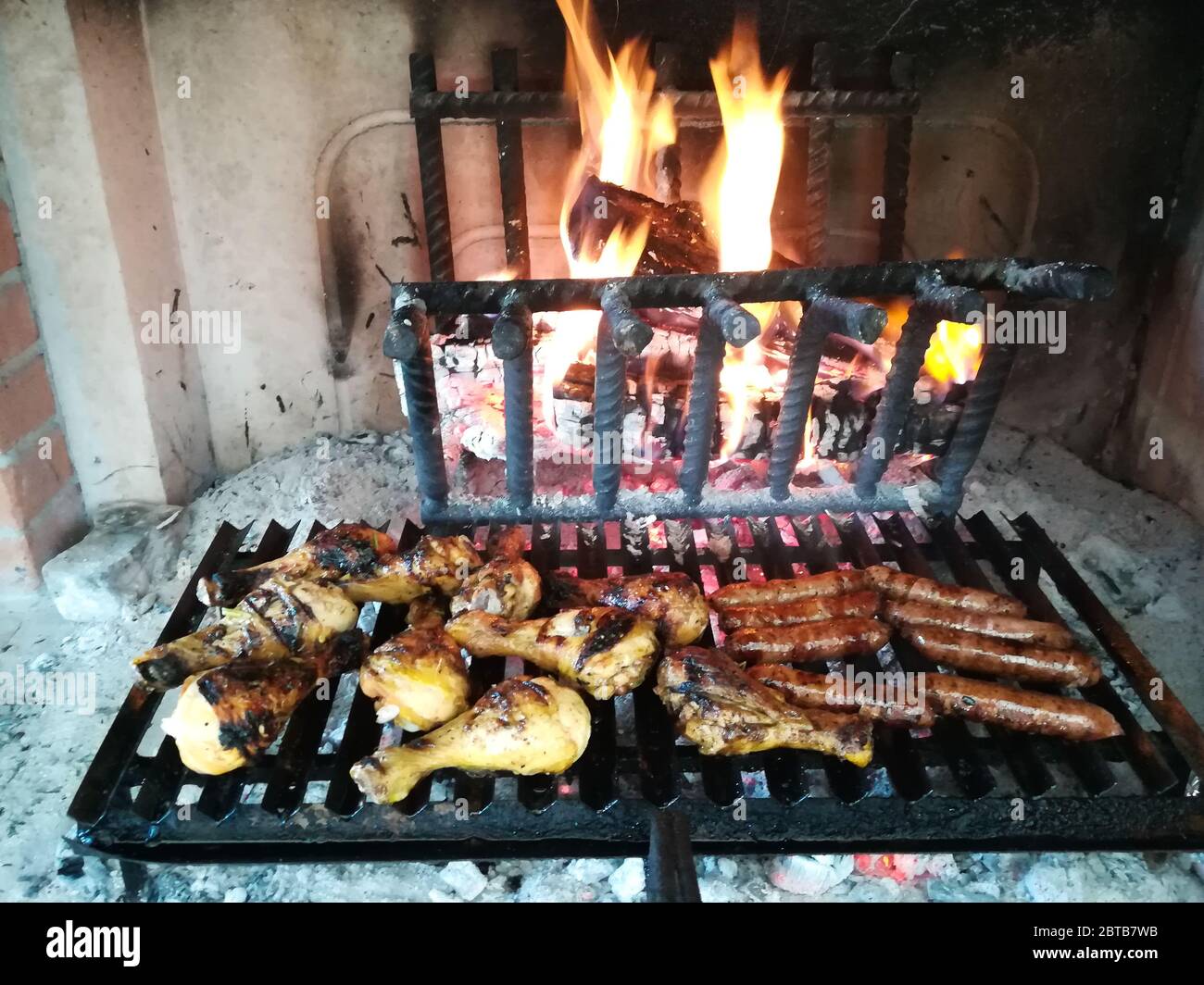 Grilled meat cooked on fireplace Stock Photo - Alamy