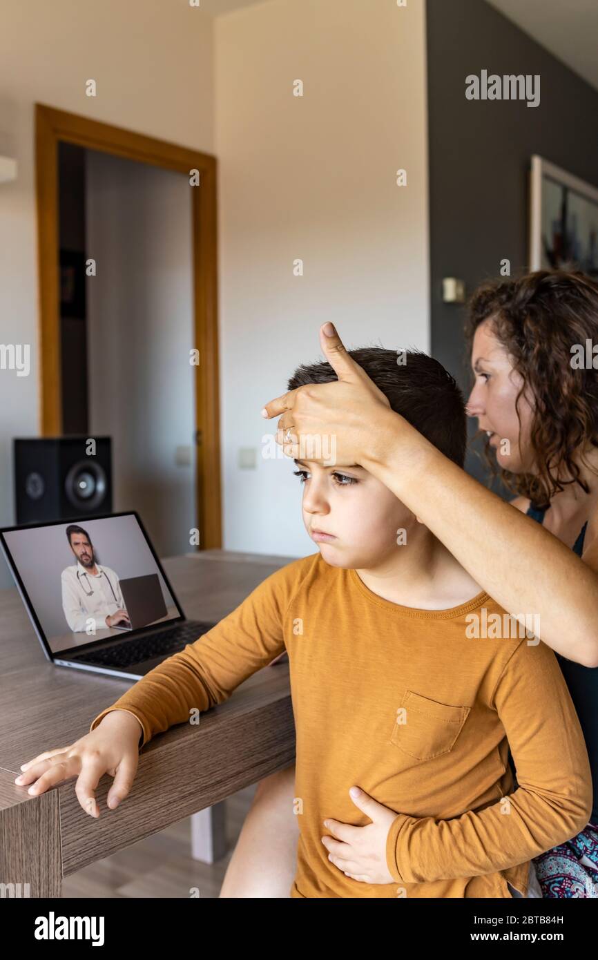 Boy woman doctor laptop hi-res stock photography and images - Alamy