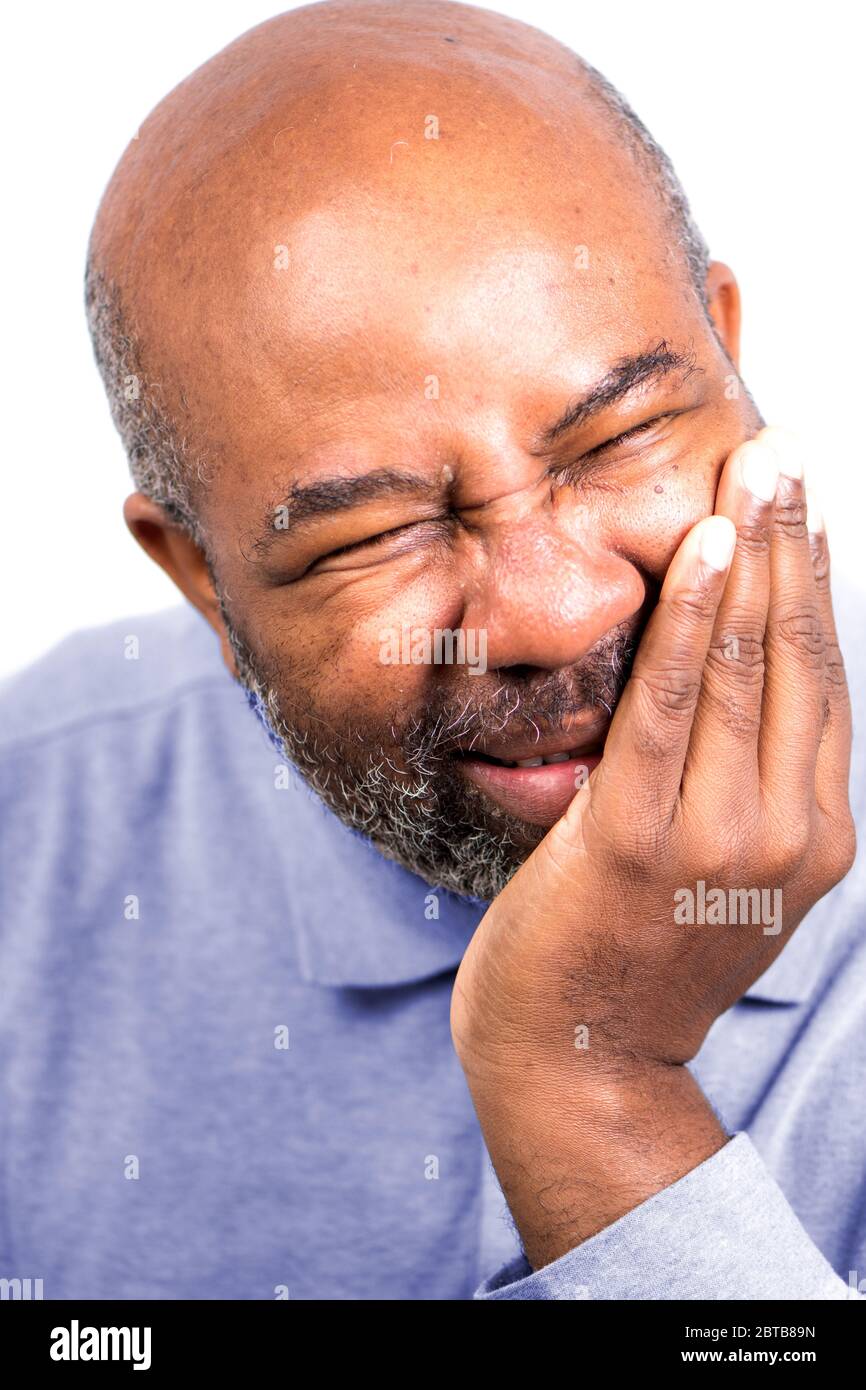 African American Man having tooth ache touching cheek. Senior with ...